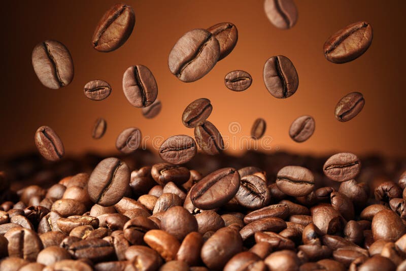 Roasted Coffee Beans Falling Onto Heap Against Brown Background ...