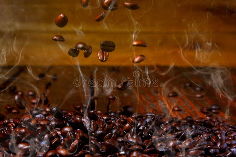 Roasted Coffee Beans Falling on Stack, Hot and Smoky. Rustic Wood ...