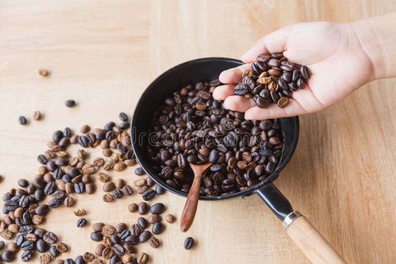 .Roasted Coffee Beans in Hand Stock Photo - Image of flavor, aroma ...