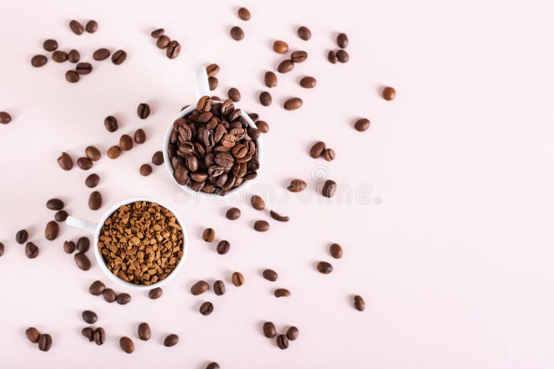 Roasted Coffee Beans and Instant Coffee in Cups on Pink Background Top ...