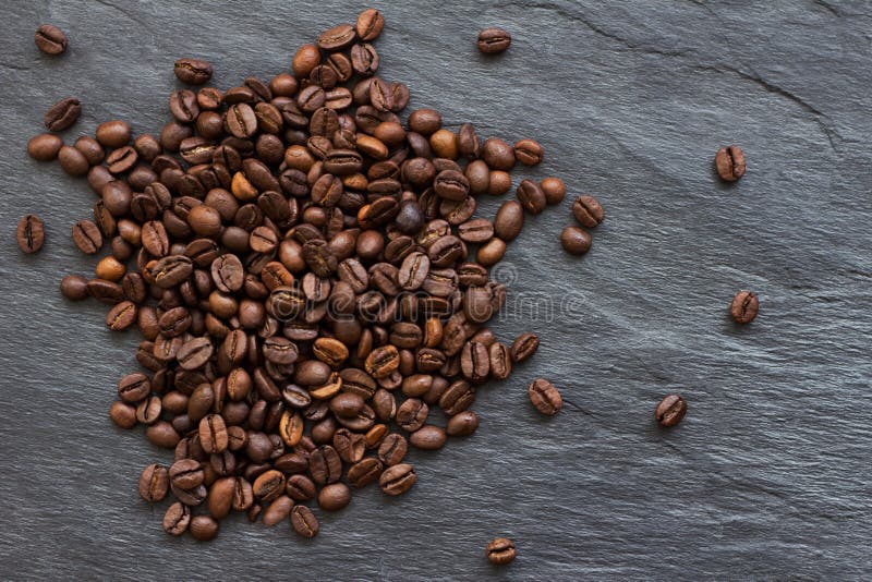 Roasted Coffee Beans on a Natural Slate Background, Left Side, Top View ...