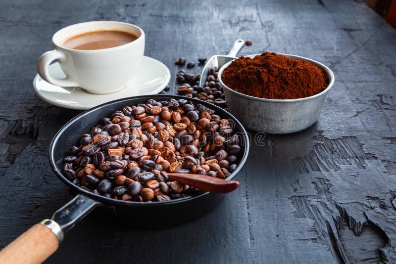 .Roasted Coffee Beans with Coffee Powder and Coffee Cups Stock Photo ...