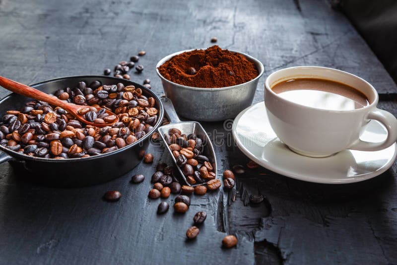 .Roasted Coffee Beans with Coffee Powder and Coffee Cups Stock Photo ...