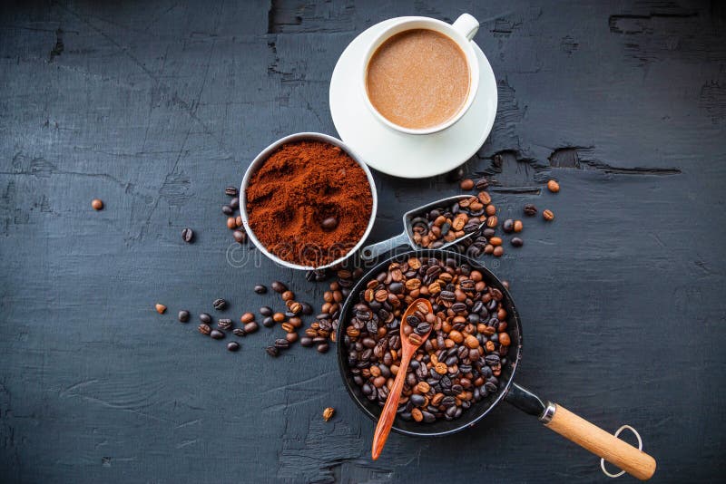 .Roasted Coffee Beans with Coffee Powder and Coffee Cups Stock Image ...