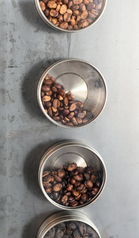 Roasted Coffee Beans in Round Package at Wall Stock Image - Image of ...