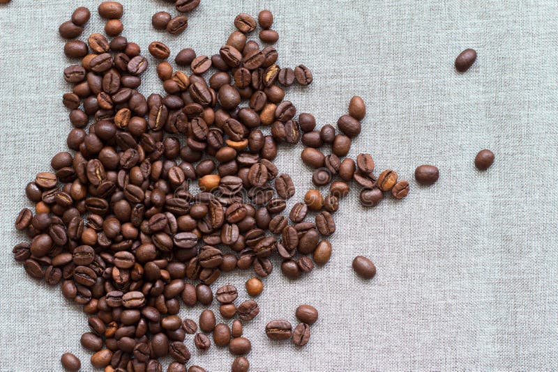 Roasted Coffee Beans Scattered on a Grey Textile Background, Top View ...