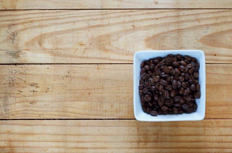 ROASTED COFFEE BEANS in a SQUARE CERAMIC BOWL Stock Image - Image of ...