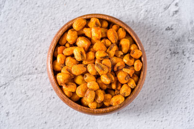 Roasted Corn Nuts with Sauce in Wooden Bowl on White Stone Table Stock ...