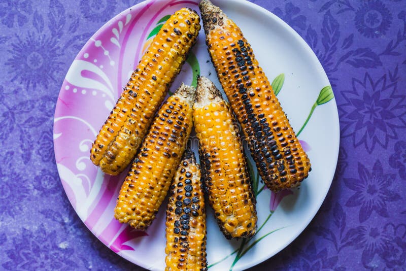 Roasted Corn on the Plate stock photo. Image of baked - 121497780