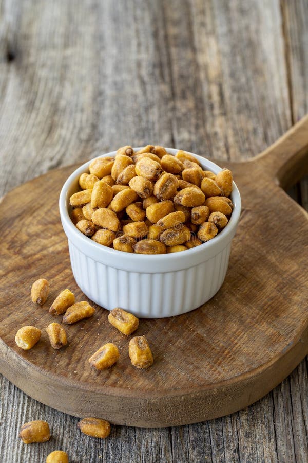 Roasted Corn Snack. Corn Nuts with Sauce on Wood Background Stock Photo ...