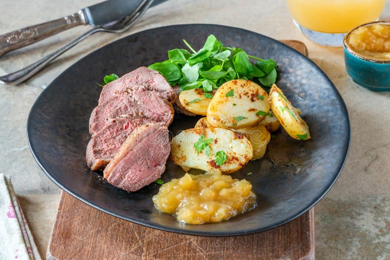 Roasted Dack with Apple Sauce Stock Photo - Image of crispy, fillet ...