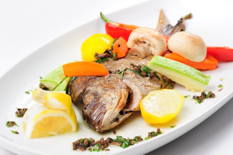 Roasted Dorada Fish with Vegetables Stock Photo - Image of dining ...