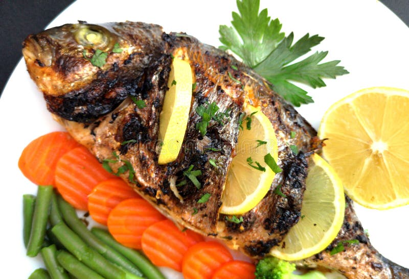Roasted Dorada Fish with Vegetables Stock Photo - Image of closeup ...