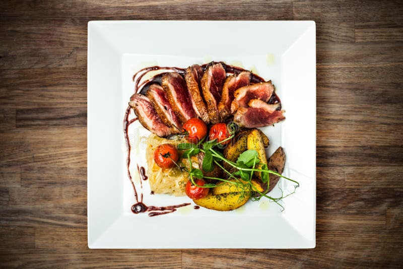 Roasted duck breast fillet stock photo. Image of dining - 6469714