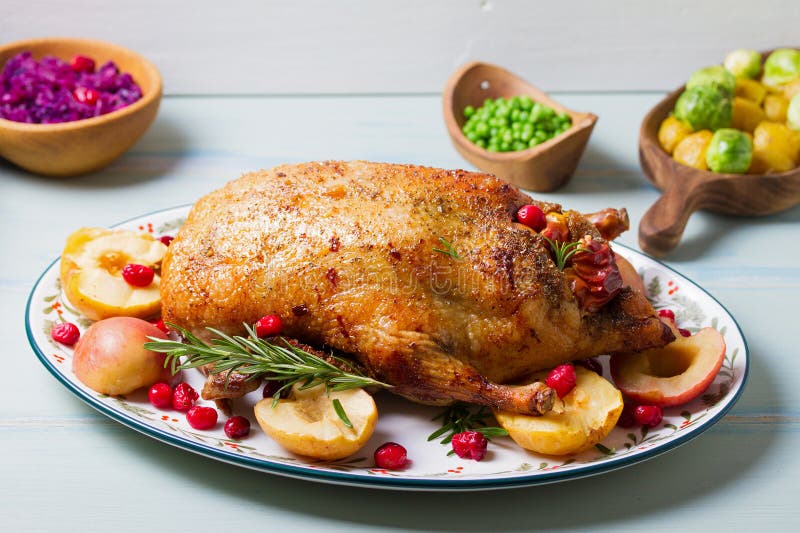Roasted Duck with Apples and Cranberries Served with Peas, Red Cabbage ...