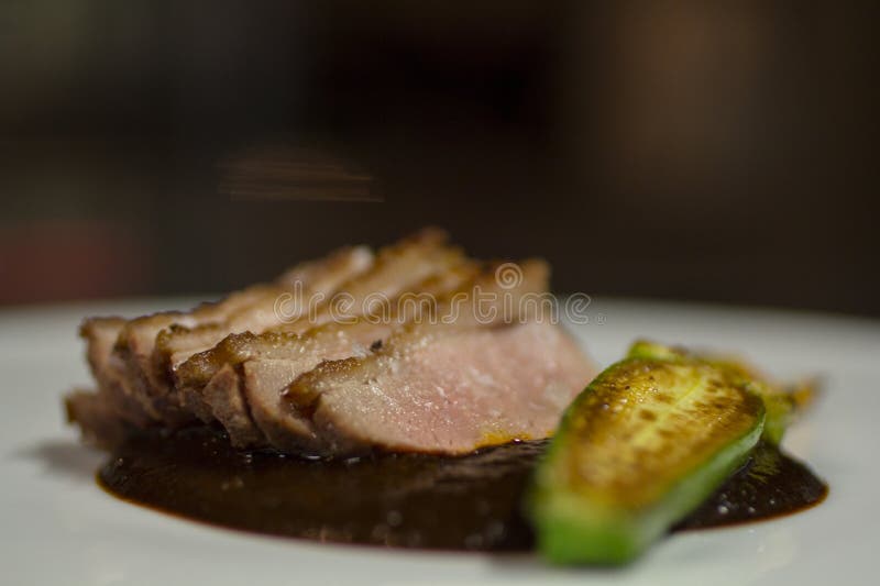Roasted Duck Breast Slices with Spicy Mole Poblano Sauce. Stock Photo ...