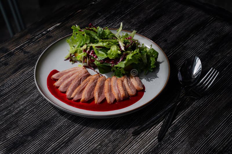 Roasted Duck Cut into Pieces on a Plate. Stock Photo - Image of chicken ...