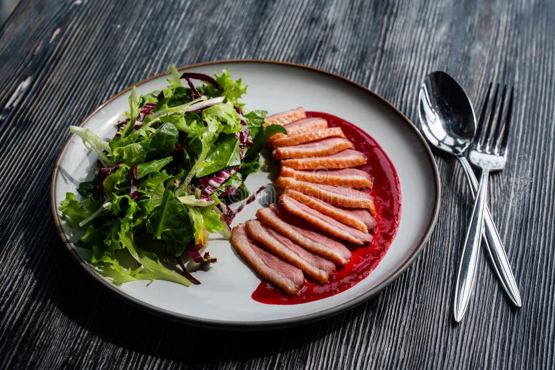 Roasted Duck Cut into Pieces on a Plate. Stock Photo - Image of meal ...