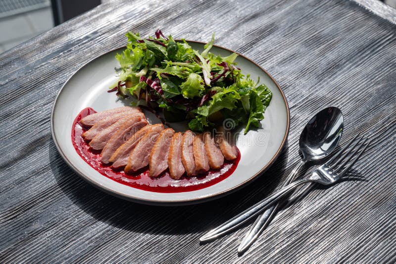 Roasted Duck Cut into Pieces on a Plate. Stock Image - Image of dining ...