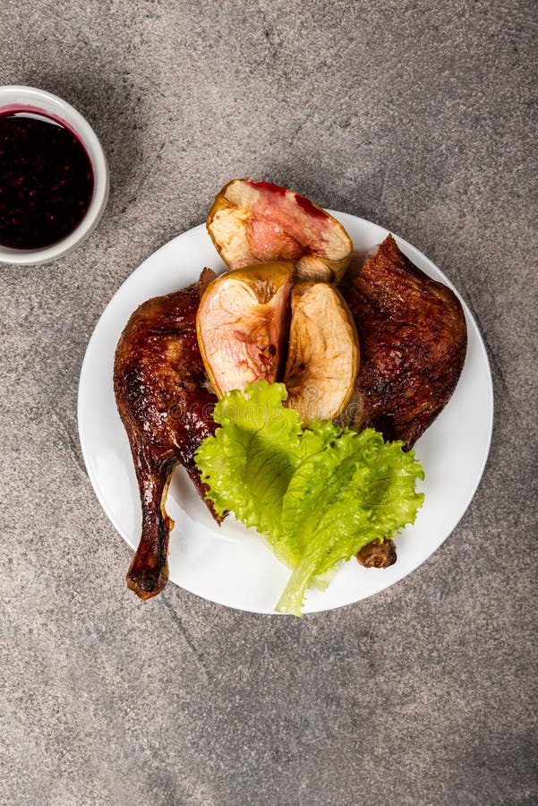 Roasted Duck Leg with Apples on a Plate. Top View. Stock Image - Image ...
