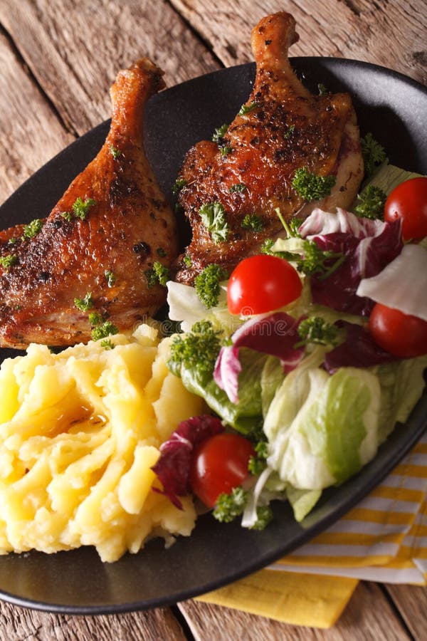 Roasted Duck Leg With Mashed Potatoes And Fresh Salad Closeup. V ...