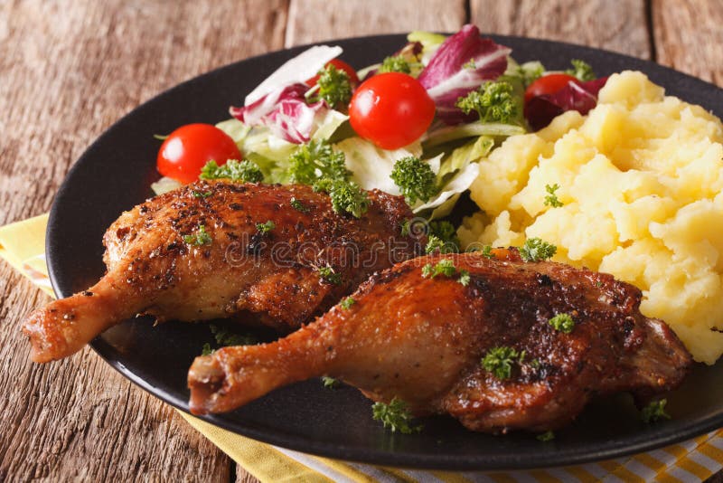 Roasted Duck Leg with Mashed Potatoes Garnish and Salad Mix Close-up ...