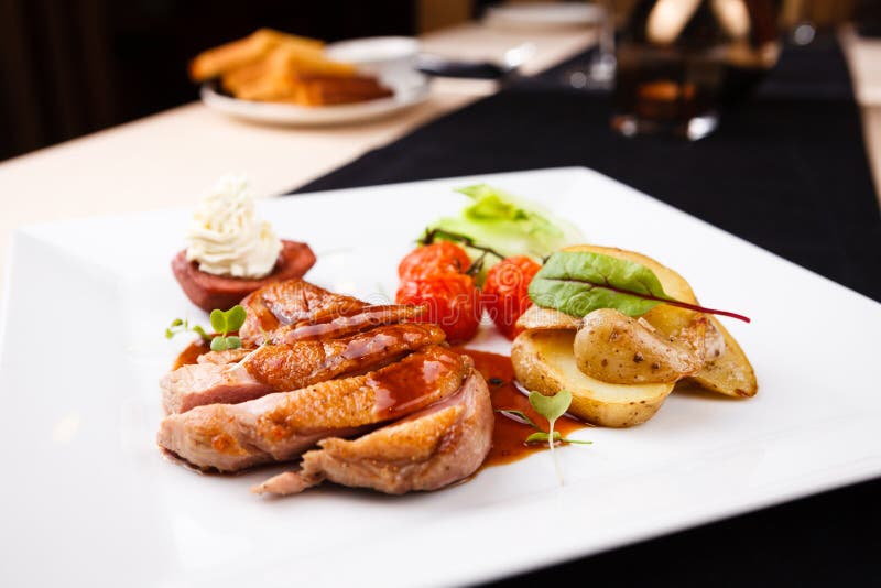 Roasted duck with pear stock image. Image of poultry - 100122647