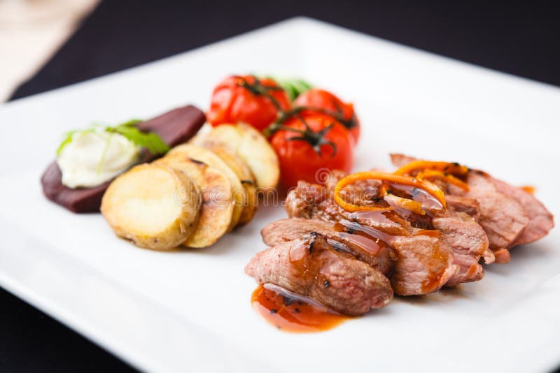 Roasted duck with pear stock image. Image of food, garnish - 101546229