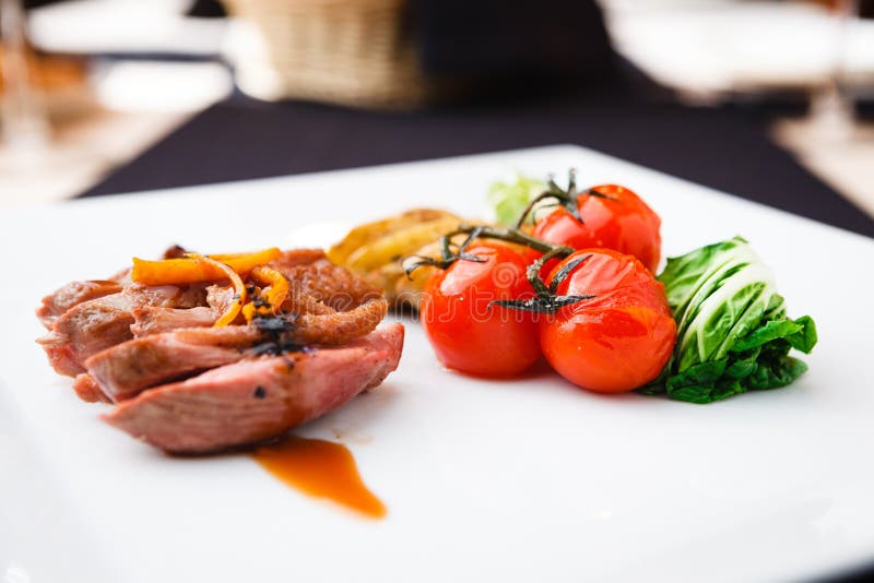 Roasted duck with pear stock image. Image of garnish - 101865979