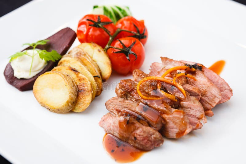 Roasted duck with pear stock photo. Image of macro, potatoes - 99756216