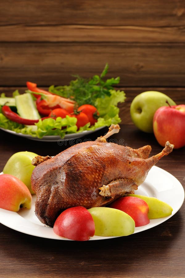 Roasted Duck Served with Fresh Vegetables and Apples on Wooden T Stock ...
