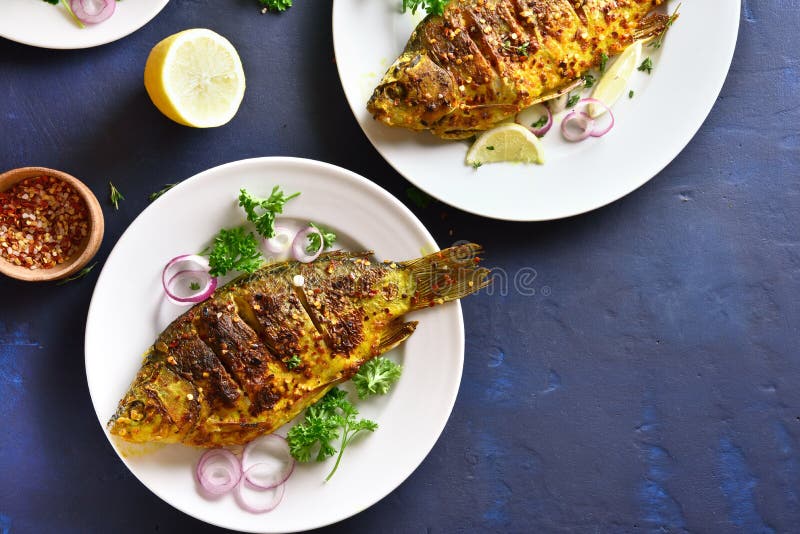 Roasted fish on plate stock image. Image of fried, fish - 148510949