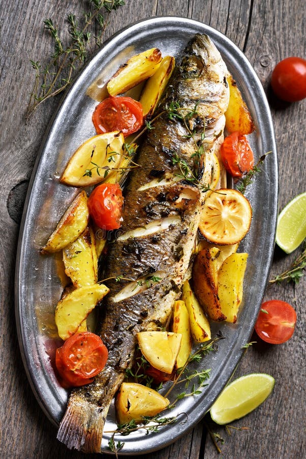 Roasted Fish with Potato Wedges Stock Image - Image of golden, dish ...