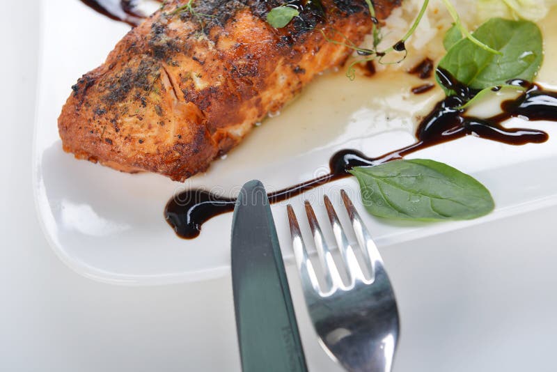 Roasted fish and rice stock image. Image of tomato, garnish - 55907133