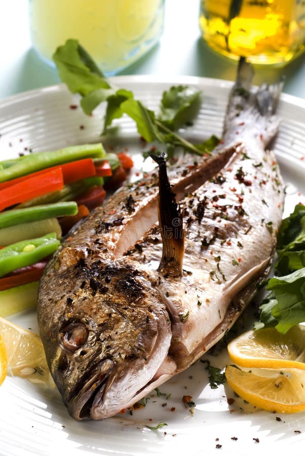 Roasted Gilt-head Bream with Vegetables Stock Photo - Image of head ...