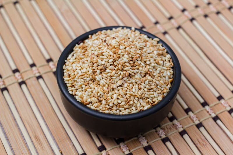 Roasted golden sesame stock photo. Image of bowl, golden - 242793370