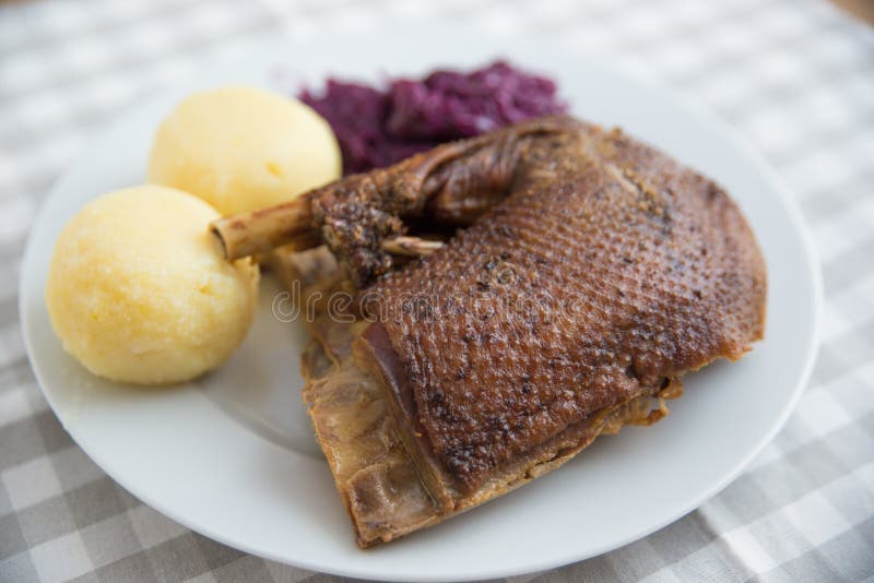 Roasted Goose Leg with Braised Red Cabbage Stock Image - Image of plate ...