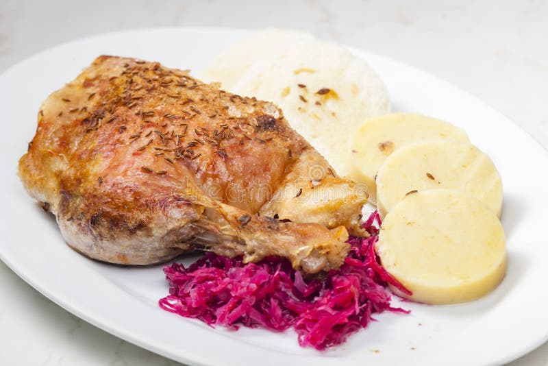 Roasted Goose Leg with Red Cabbage and Dumplings Stock Image - Image of ...