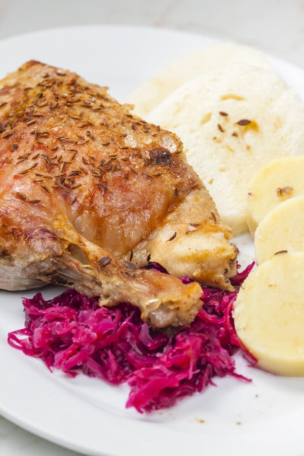 Roasted Goose Leg with Red Cabbage and Dumplings Stock Photo - Image of ...
