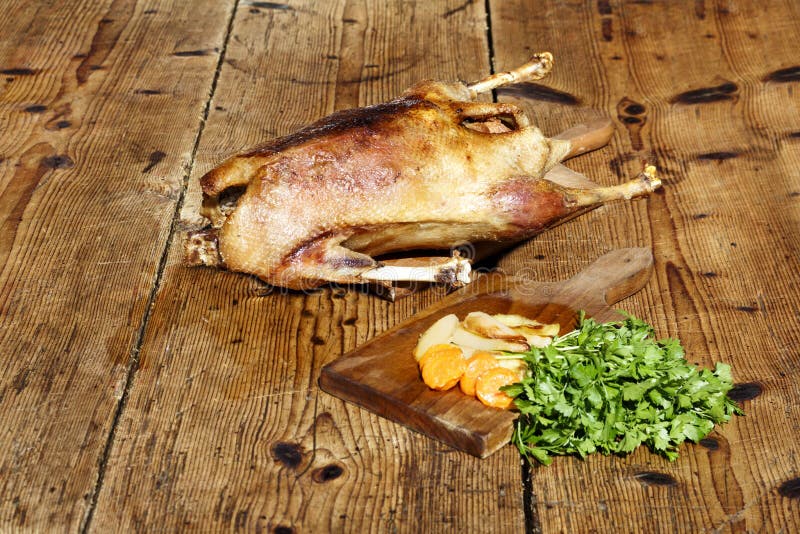 Roasted Goose on Wooden Table Stock Image - Image of potato, grey: 79043435