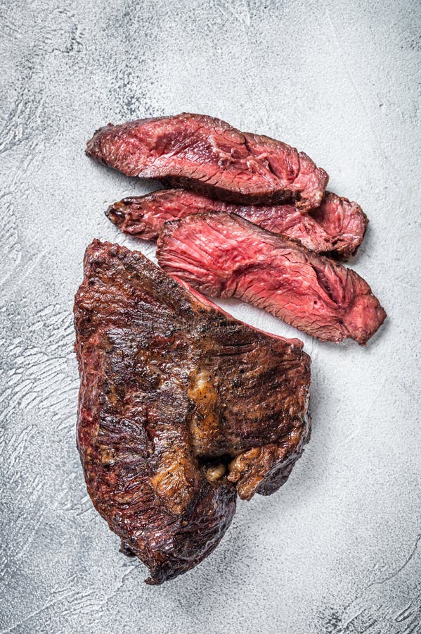 Roasted Hanger or Onglet Sliced Beef Meat Steak on a Table. White ...