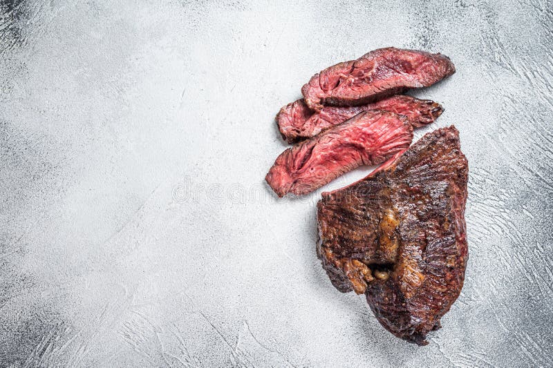 Roasted Hanger or Onglet Sliced Beef Meat Steak on a Table. White ...