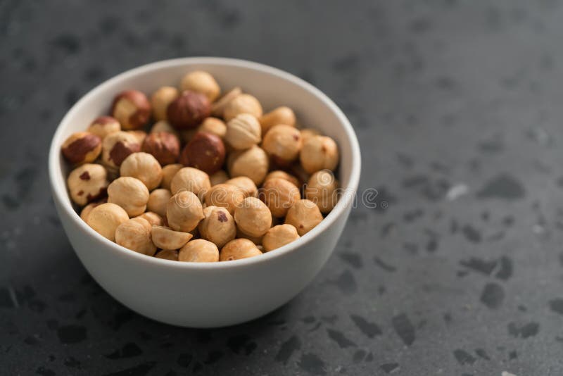 Roasted Hazelnuts in White Bowl on Concrete Background Stock Image ...