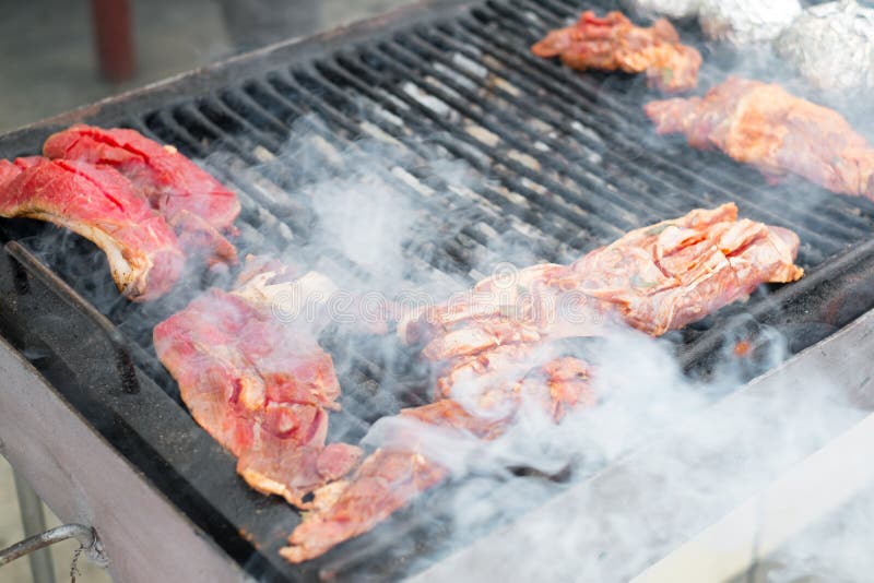 Roasted Juicy Meat Cooked Over the Coals on a Barbecue Stock Photo ...