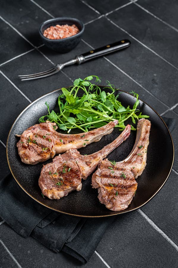 Roasted Lamb Meat Cutlets, Mutton Chops with Garnish. Black Background ...