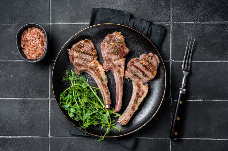 Roasted Lamb Meat Cutlets, Mutton Chops with Garnish. Black Background ...
