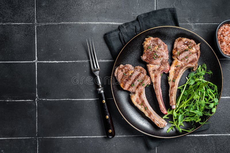 Roasted Lamb Meat Cutlets, Mutton Chops with Garnish. Black Background ...