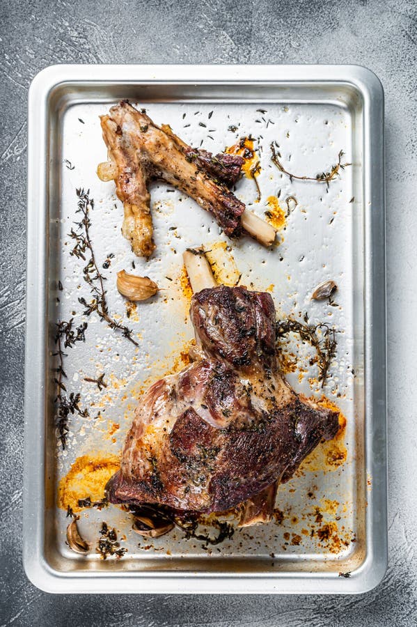 Roasted Lamb Mutton Whole Leg in a Baking Dish. White Background Stock ...