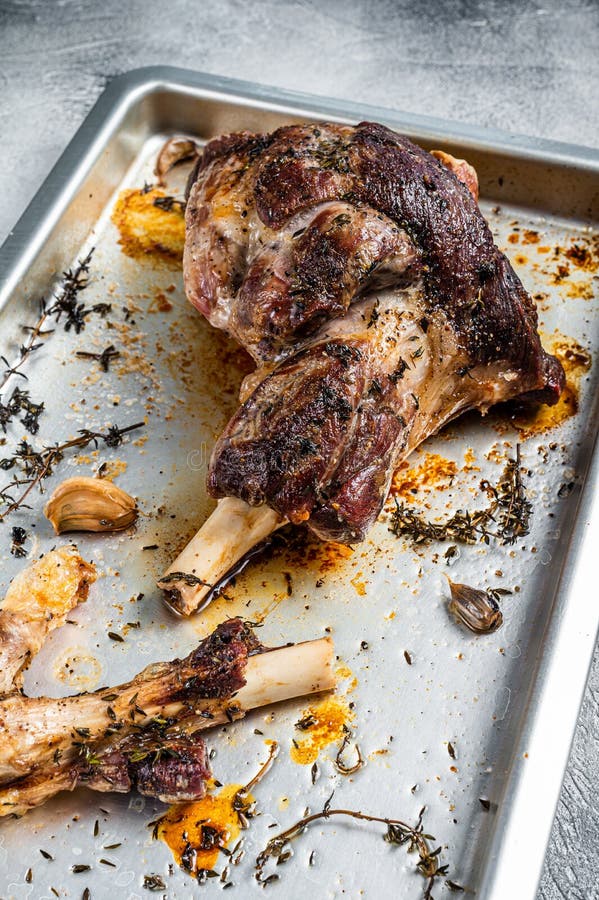 Roasted Lamb Mutton Whole Leg in a Baking Dish. White Background Stock ...
