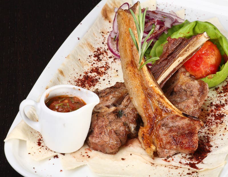 Roasted lamb ribs stock photo. Image of gravy, onion, racks - 3325716